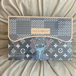 Makeup | Lip Gloss Vault Featuring Stitch With A Beautiful Designer ...